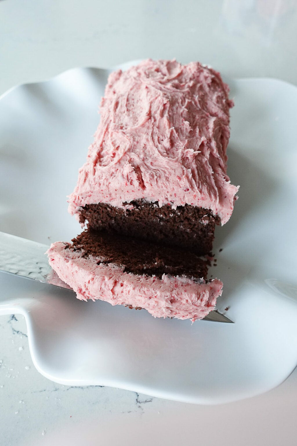 Chocolate Loaf Cake with Strawberry Frosting - Sip Bite Go
